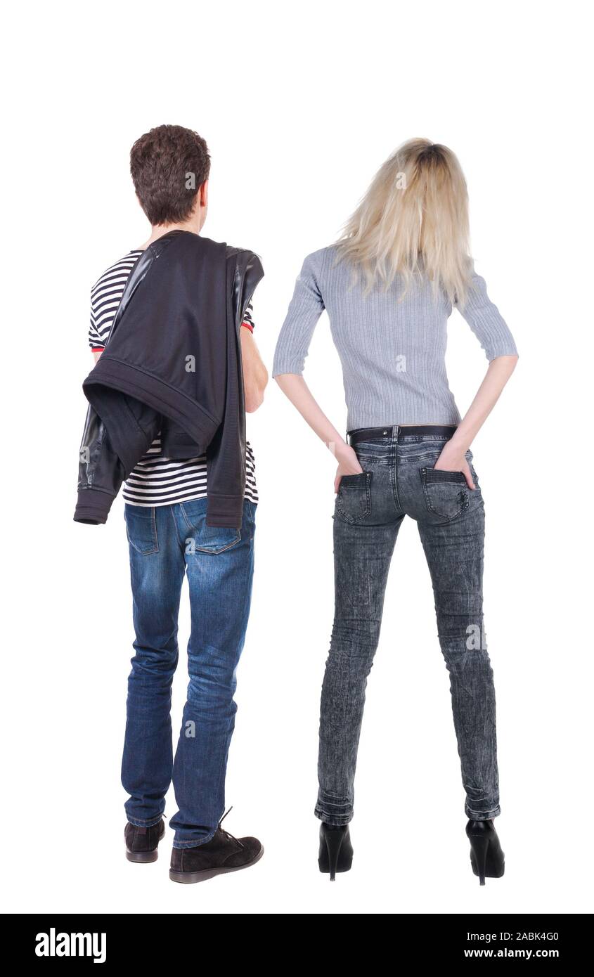 Back view of couple. beautiful friendly girl and guy together. Rear ...