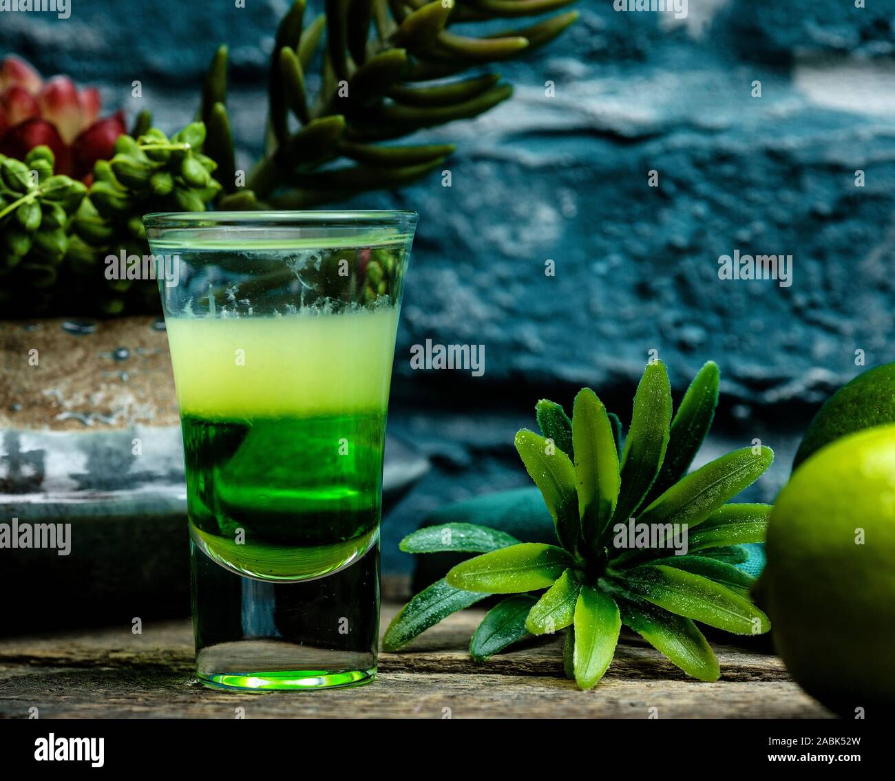 shot of green cocktail with herbs Stock Photo - Alamy