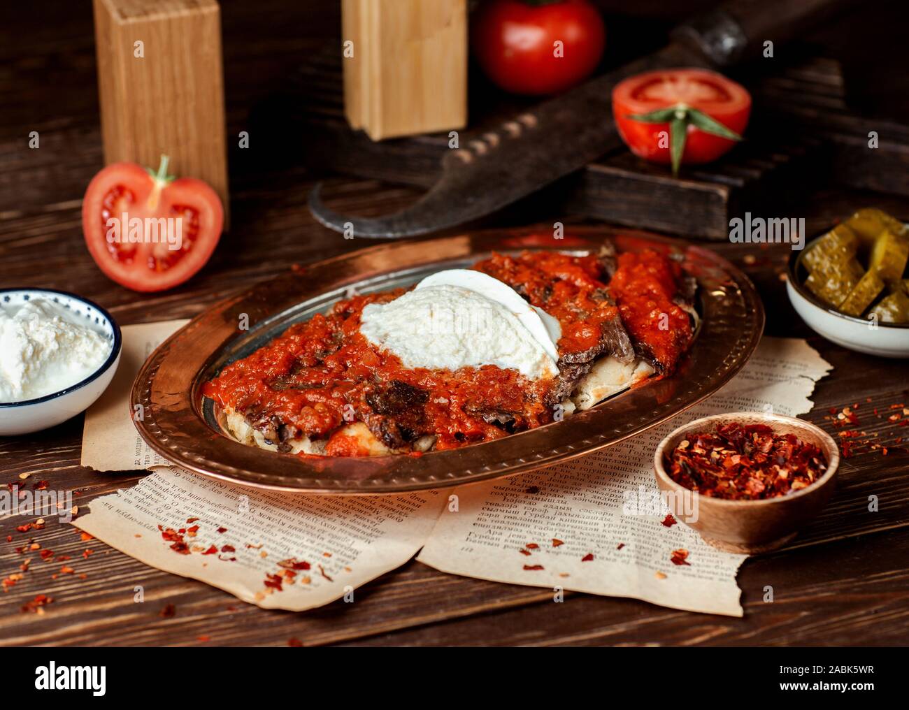 portion doner topped with sour cream and tomato pasta Stock Photo - Alamy