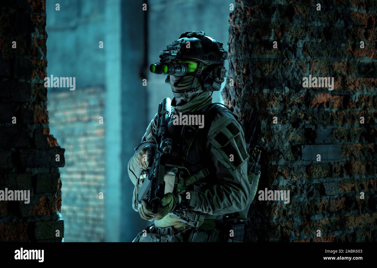 Airsoft man in uniform with machine gun and night-vision device on ...