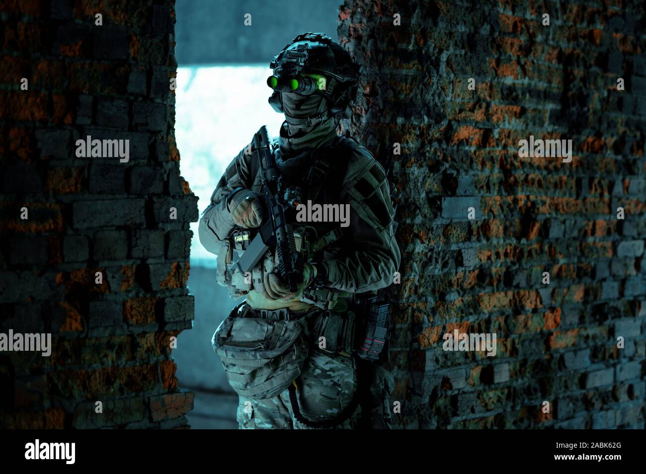 Airsoft man in uniform with machine gun and night-vision device on ...
