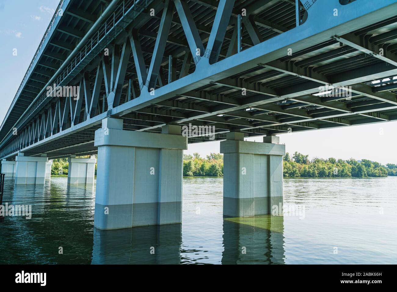 Long bridge perspective, view from below and close up. Big bridge ...