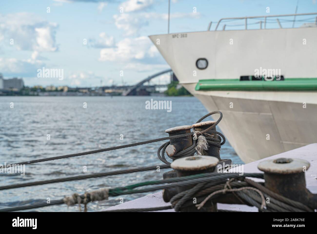 Farm laborer close up with moored ships on the berth in summer Stock ...