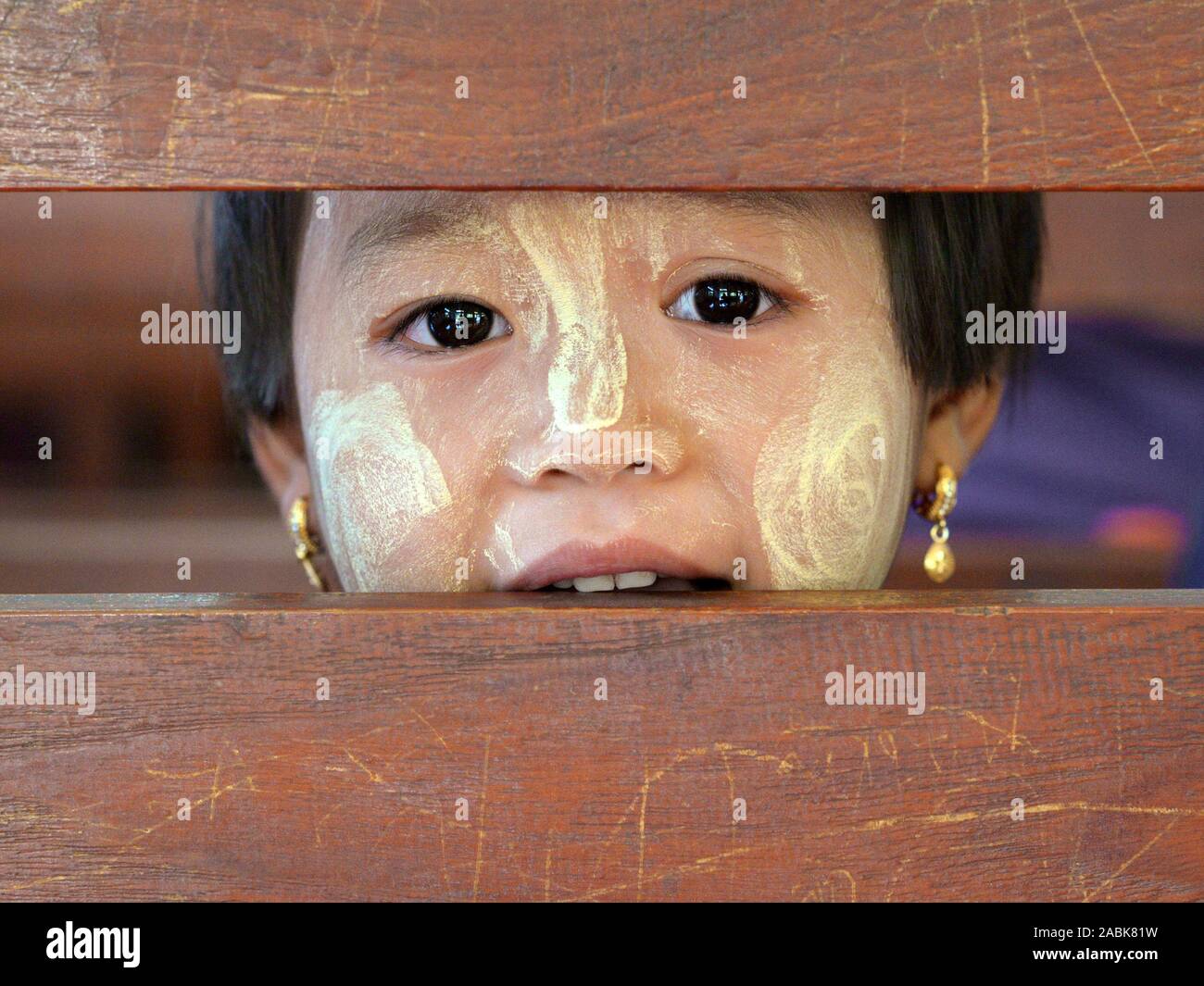 Little Thai Karen girl with Burmese thanaka face cosmetic on her nose ...