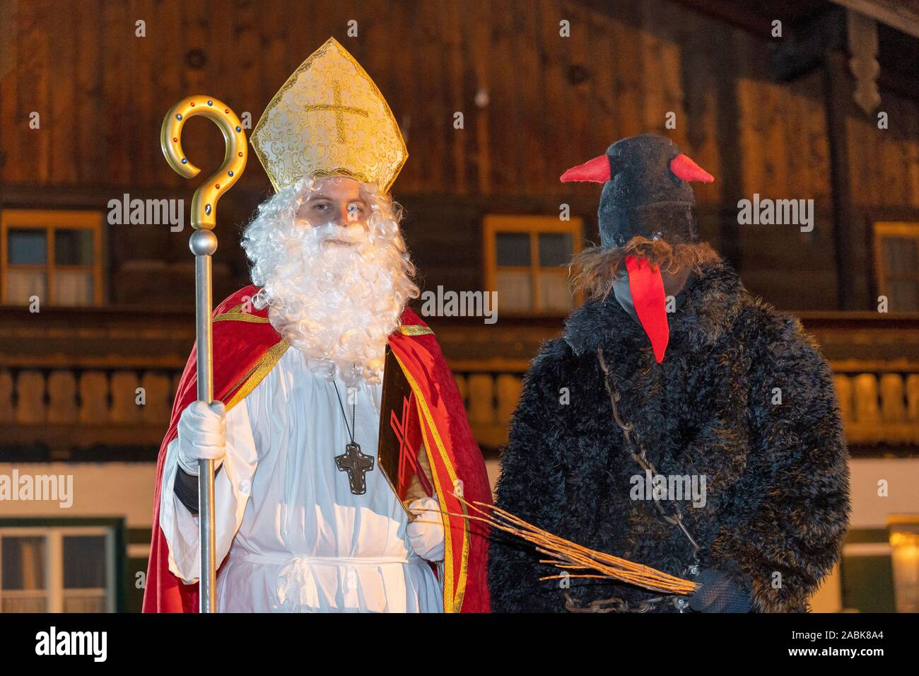 Saint Nicholas and a Krampus on their way from home to home. Upper ...