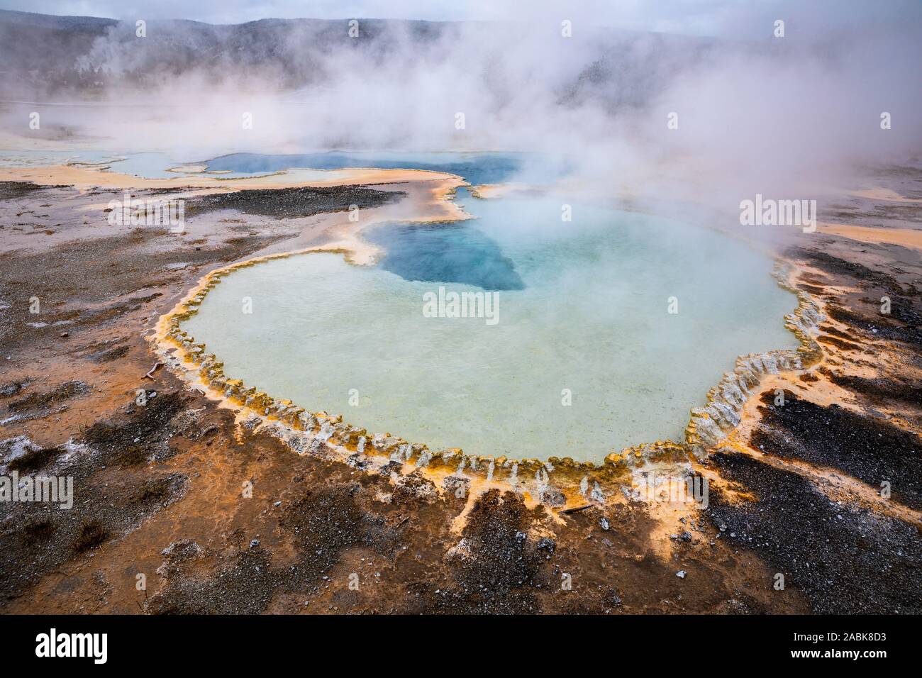 Blue geyser basin with boiling water from geothermal heat, Yellostone ...