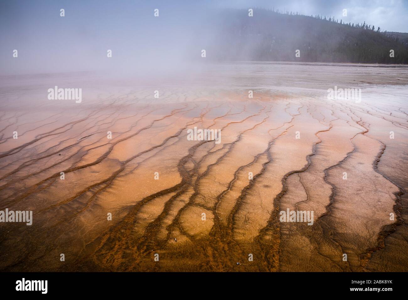 Smoke covered pattern orange pond of Grand Prismatic Spring, famous ...