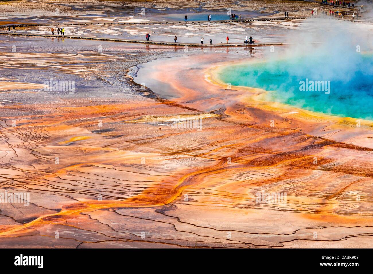 Aerial of Grand Prismatic Spring turning to bright orange and blue when ...