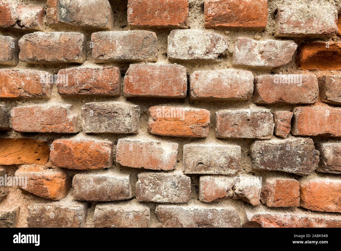 Old and partially damaged brick wall textured background Stock Photo ...