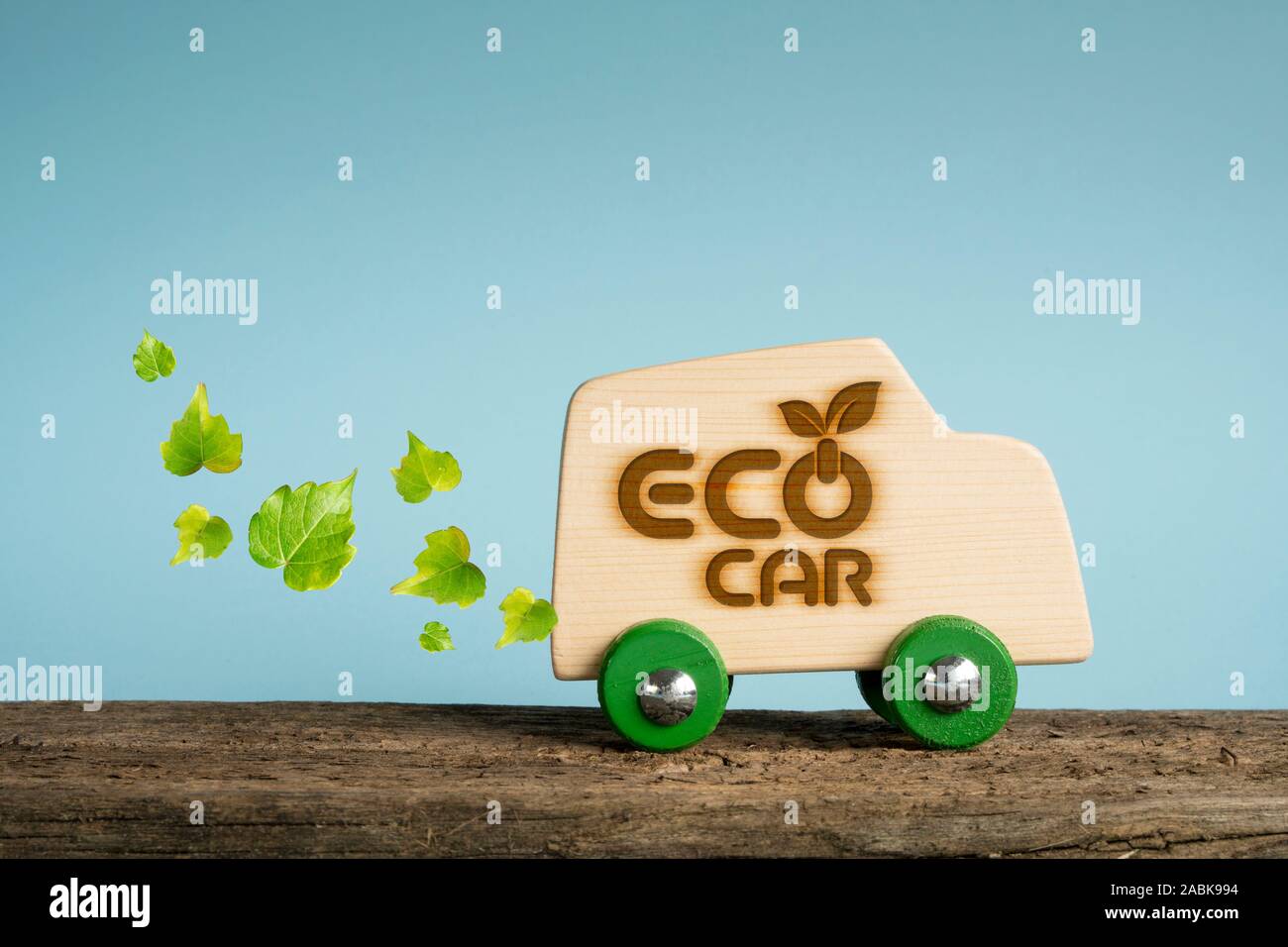 Concept of eco car. Wooden toy car with leaves and words Eco Car ...