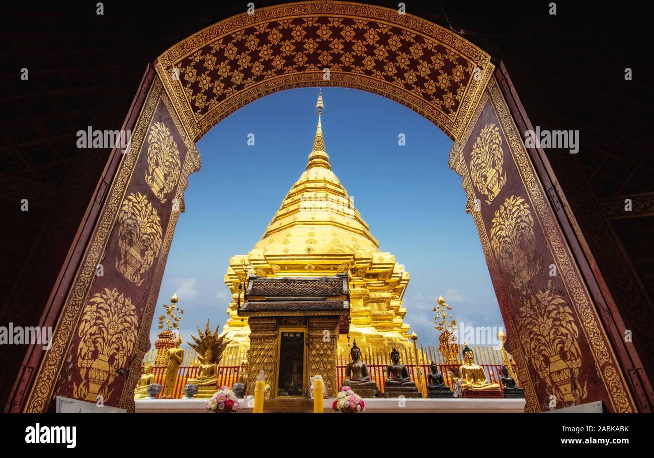 golden pagoda view through from ancient door architrave arch at Wat ...