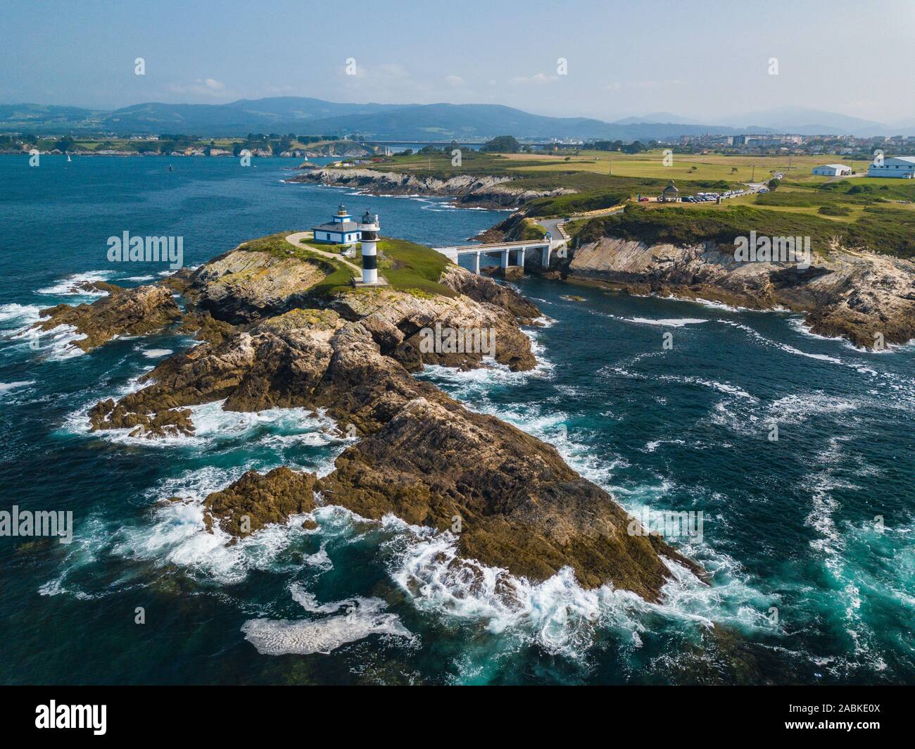Aerial view of the lighthouse on Pancha island. Northern Spain in ...