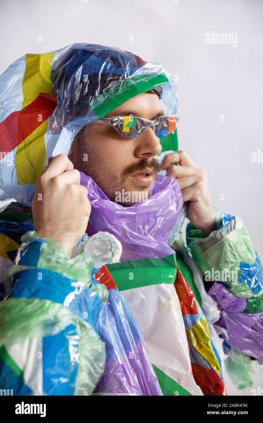 Close up of man wearing plastic on white background. Male model in ...