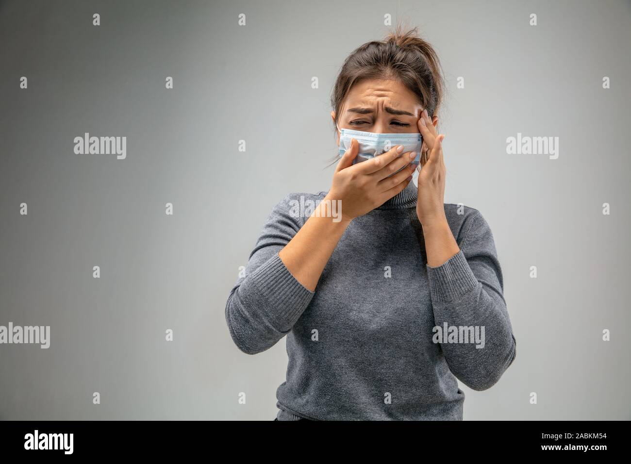 Can't breathe. Caucasian woman wearing the respiratory protection mask ...