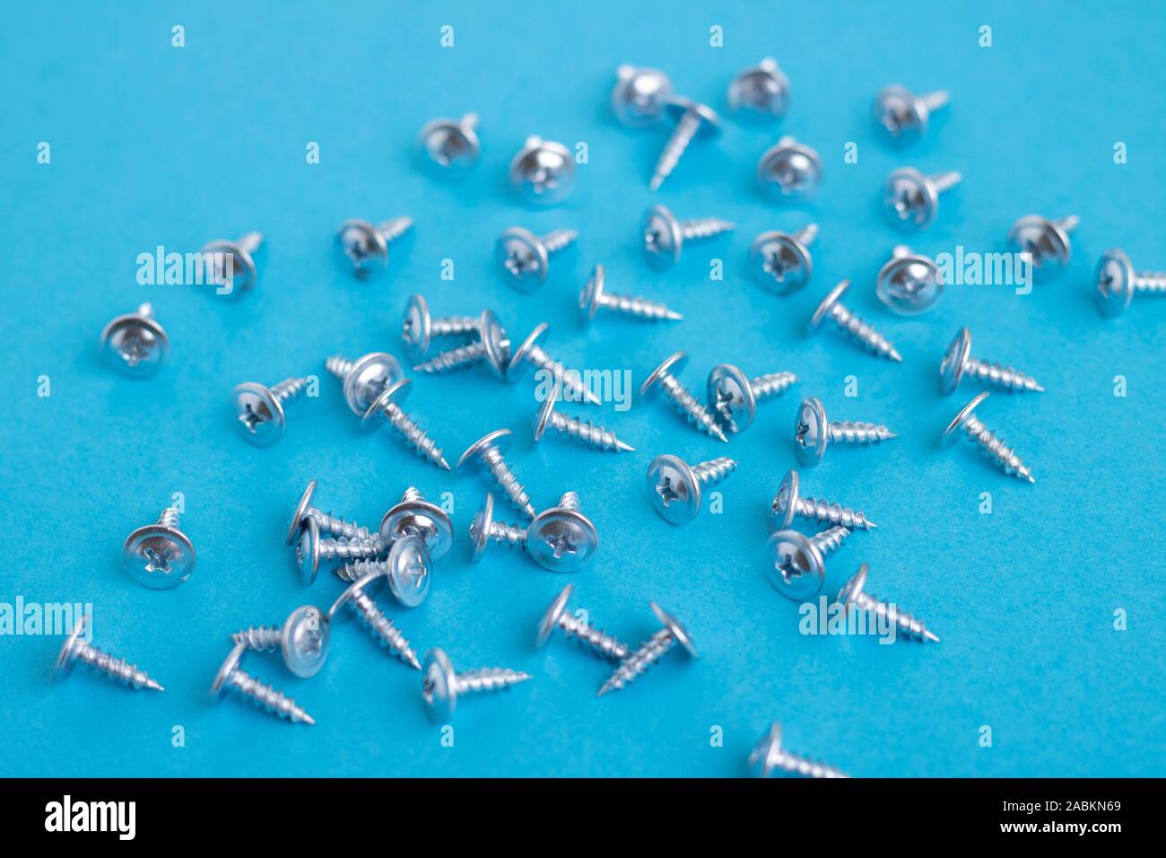Short white screws to build furniture, nobody Stock Photo - Alamy