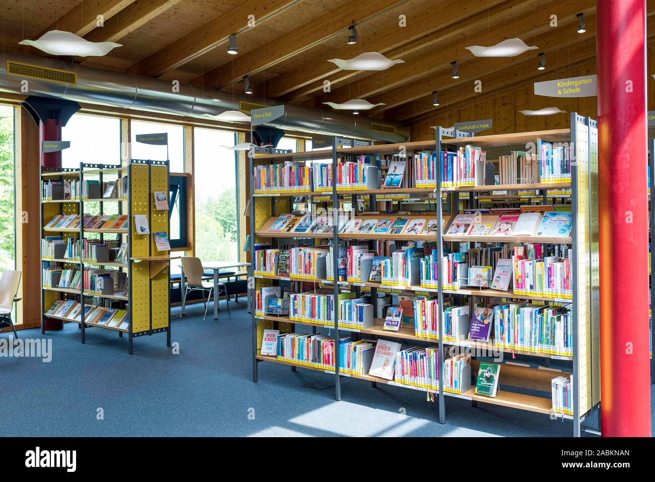 Bookshelves in the library of the community Oberhaching. The municipal ...