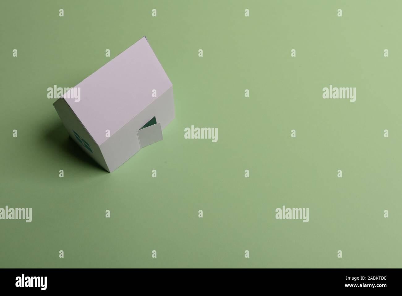 White family paper house , stack of money coins, house projects plan ...