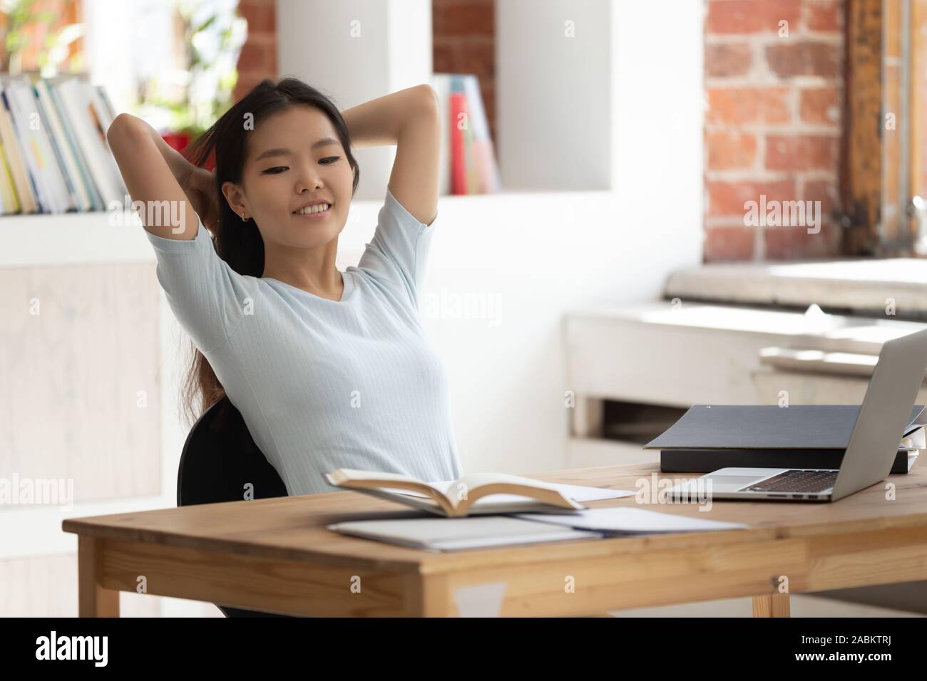 Happy young female college student relaxing during break in study Stock ...