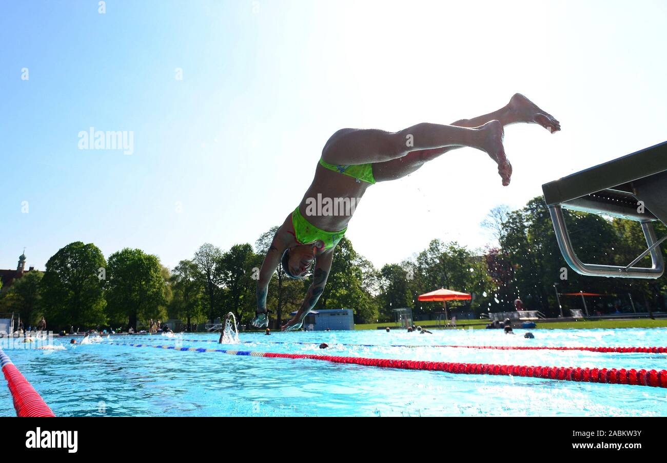Swimmers on the opening day of the 2019 outdoor swimming pool season at ...