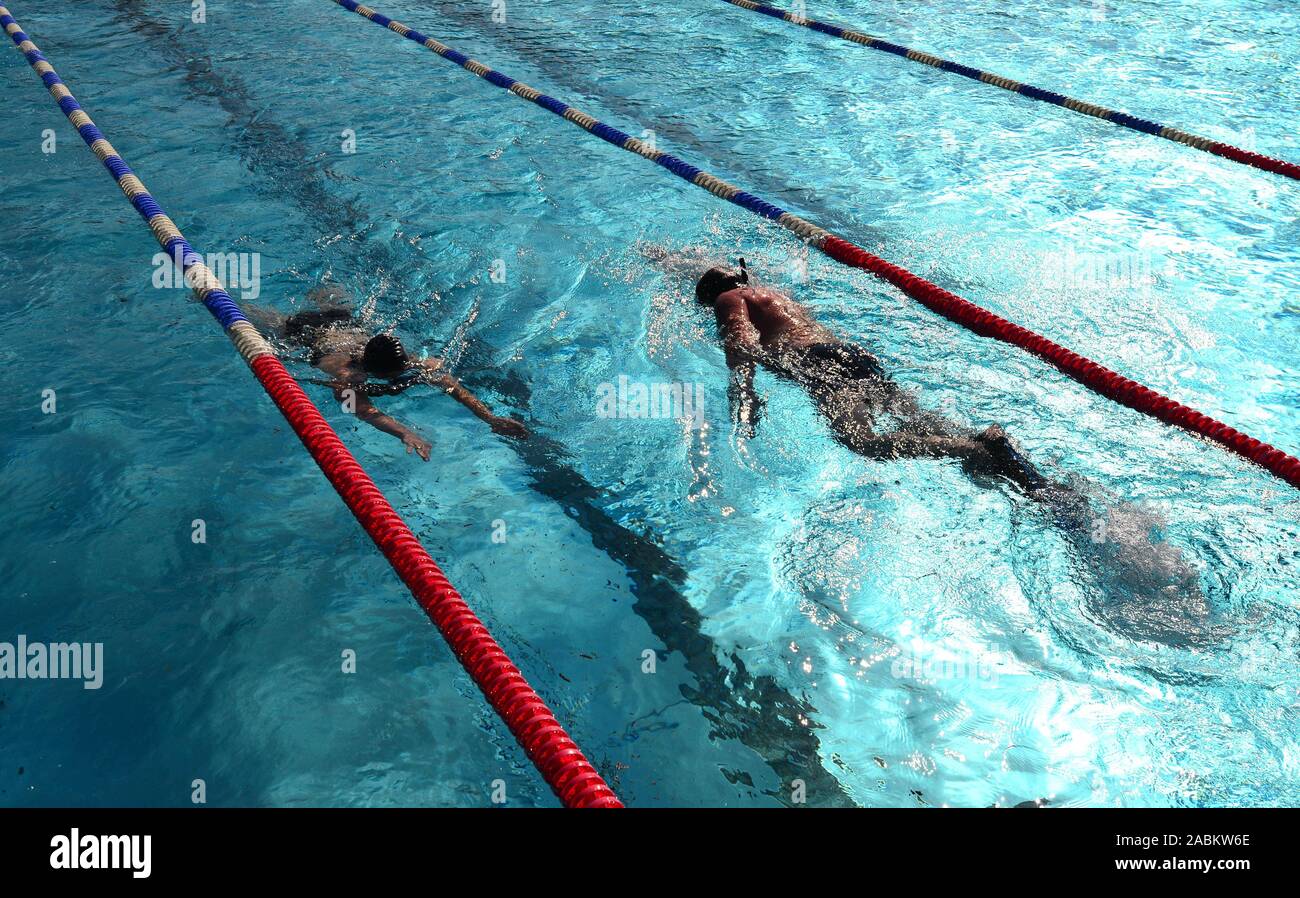 Swimmers on the opening day of the 2019 outdoor swimming pool season at ...