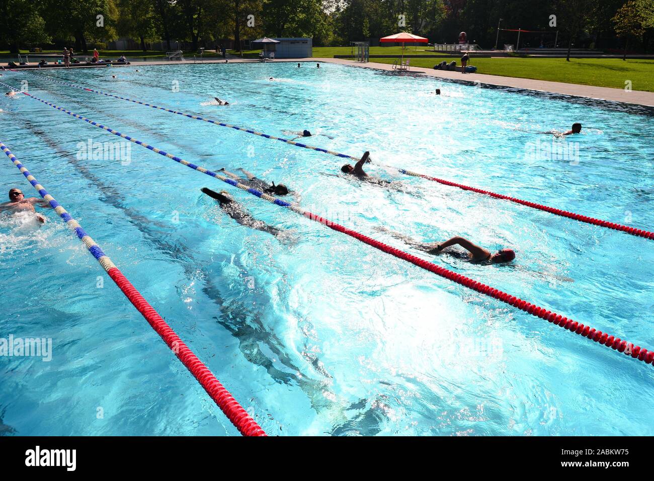 Swimmers on the opening day of the 2019 outdoor swimming pool season at ...