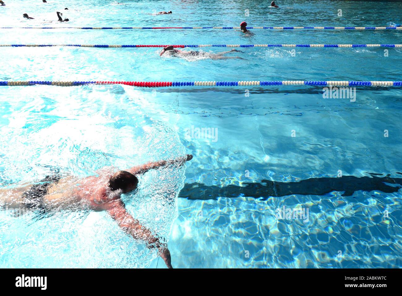 Swimmers on the opening day of the 2019 outdoor swimming pool season at ...