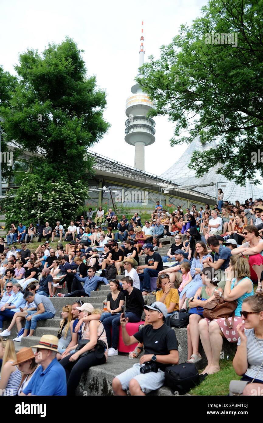 Whitsun weekend in Munich. At the Theatron festival in Munich the spectators sit on the stands in front of the stage. automated translation Stock Photo Alamy
