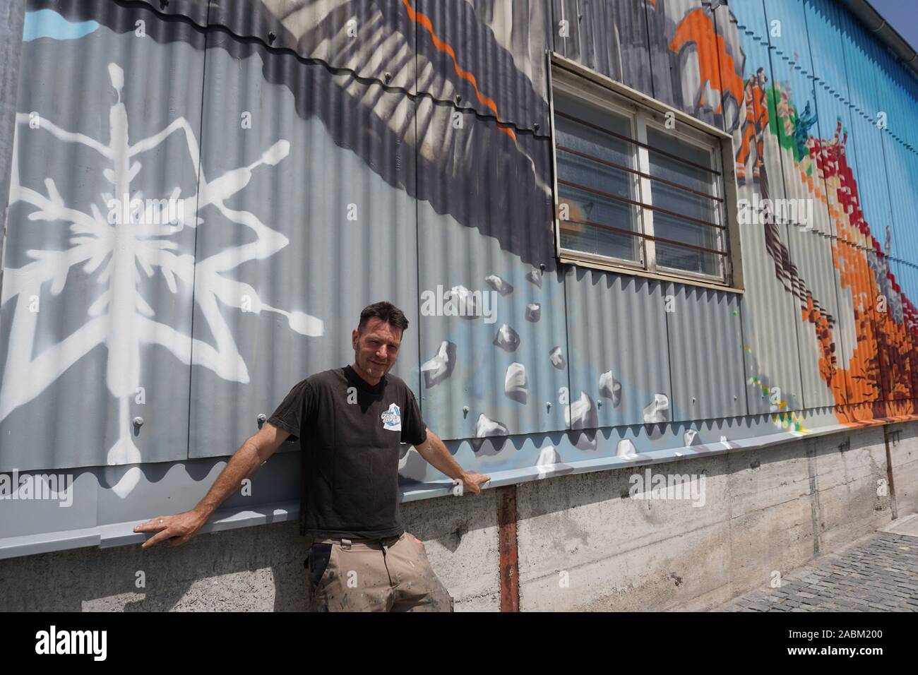 Graffiti artist Loomit (Mathias Köhler) in front of one of his ...