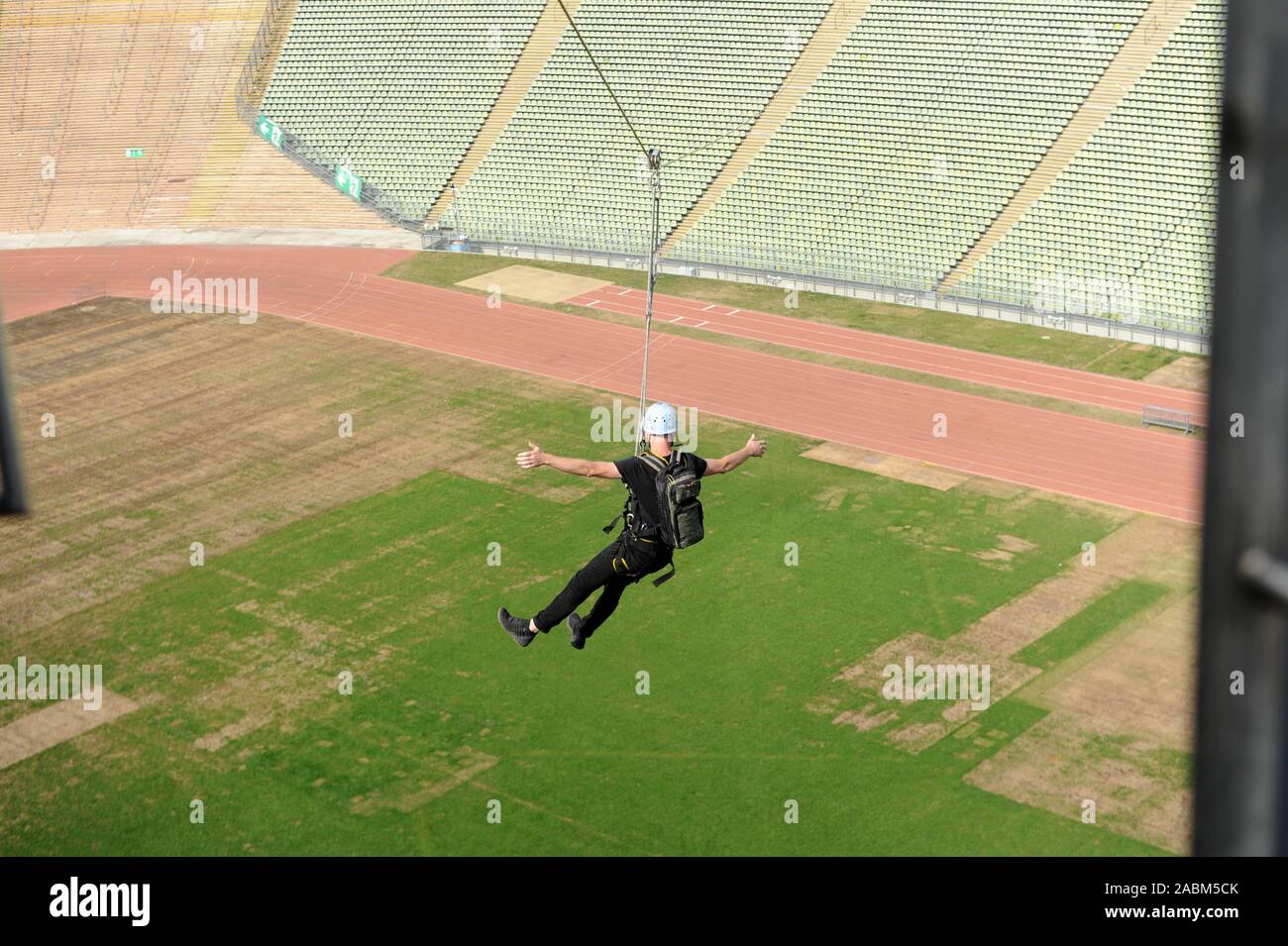 Stadium visitors on a ride with the Flying Fox rope slide over the ...