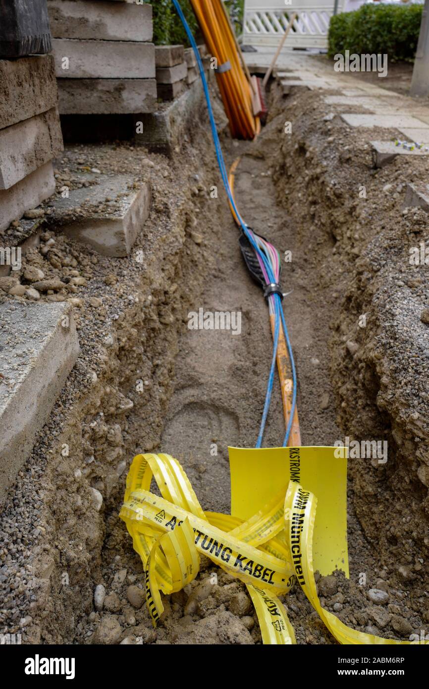 Construction site laying of fiber optic cable hi-res stock photography ...