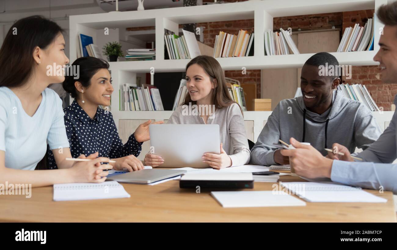 Group of happy diverse students discussing school project together ...