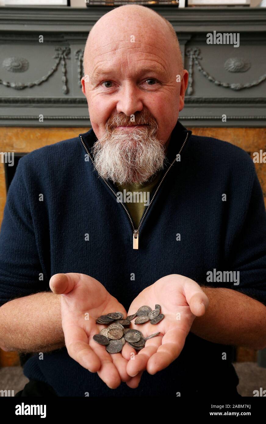 Builder and metal detectorist Don Crawley holds a collection of Anglo ...