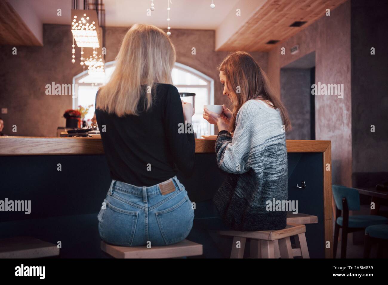 Toned picture of best friends having date in cafe or restaurant ...