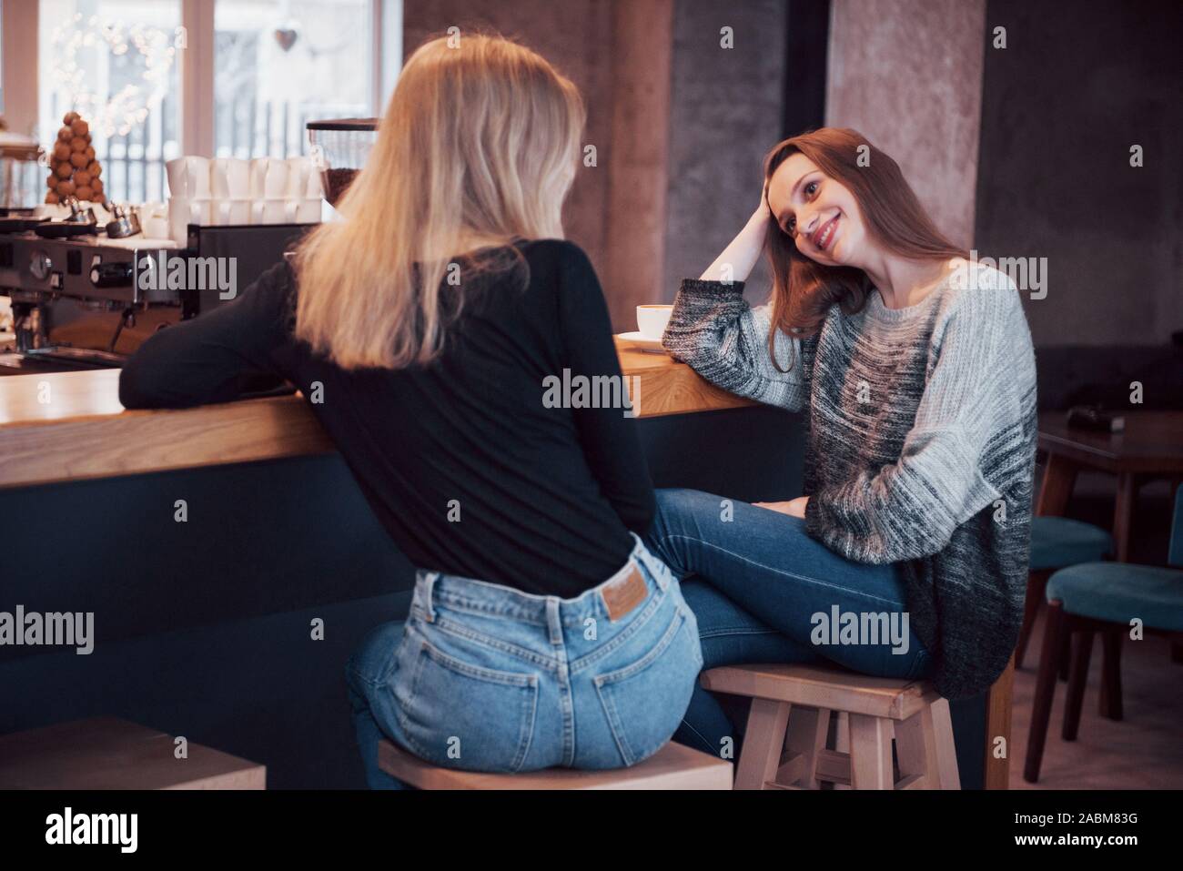 Toned picture of best friends having date in cafe or restaurant ...