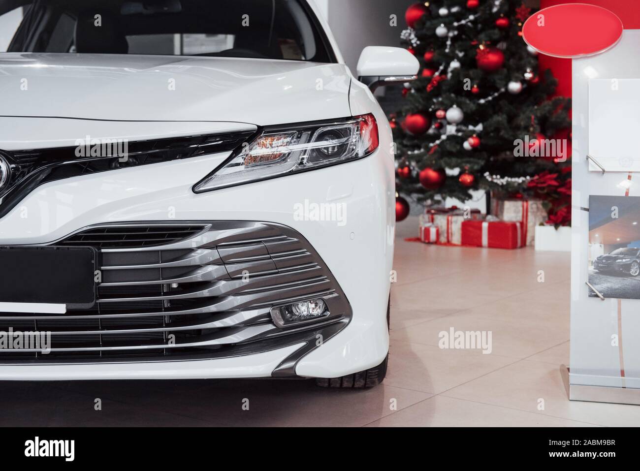 New shining beautiful cars stand near desk reception in car shop Stock ...