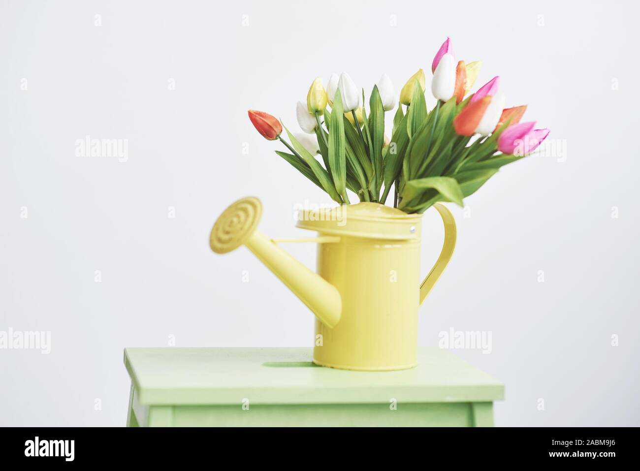 yellow funnel with small colored flowers tulps. Beutiful spring flowers ...