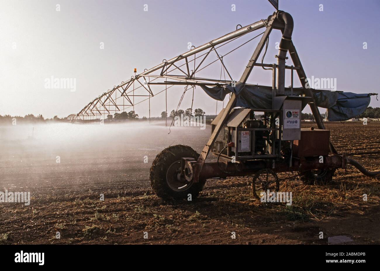 Watering fields by Moving Irrigation pipes Stock Photo - Alamy