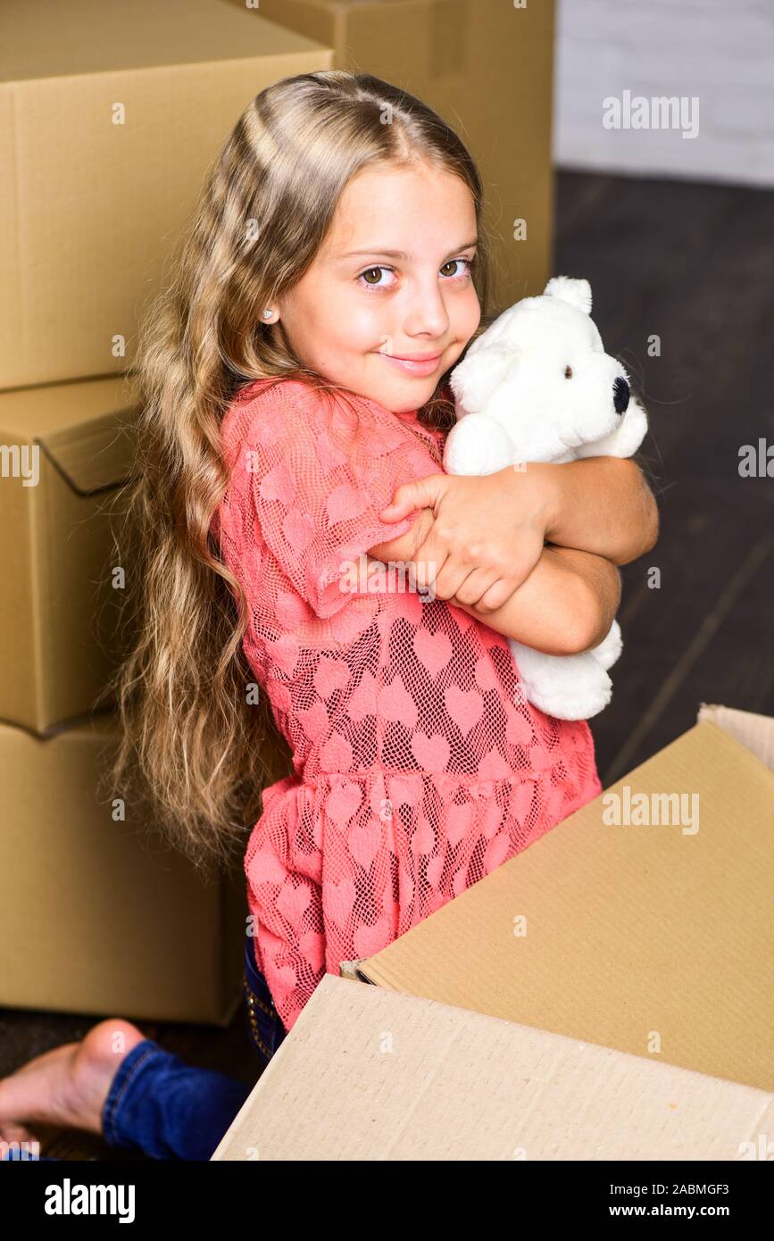 Small child prepare toys for relocation. Kid girl relocating boxes ...