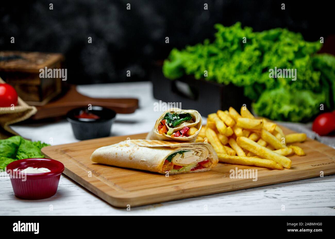 chicken wrap with side french fries Stock Photo - Alamy
