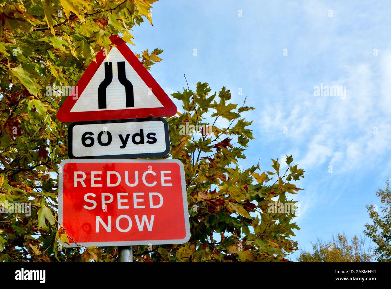 Maidstone, Kent, UK. Reduce Speed Now sign at a narrowing of a road ...