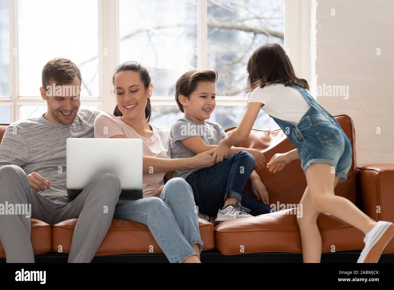 Happy family have fun relaxing at home together Stock Photo - Alamy