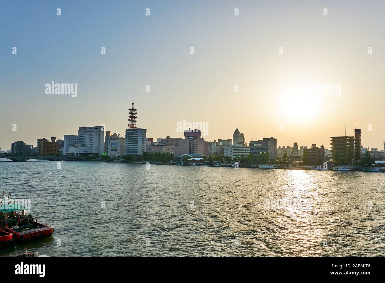 Sunset at Niigata City in Japan across the Shinano river on a summer ...