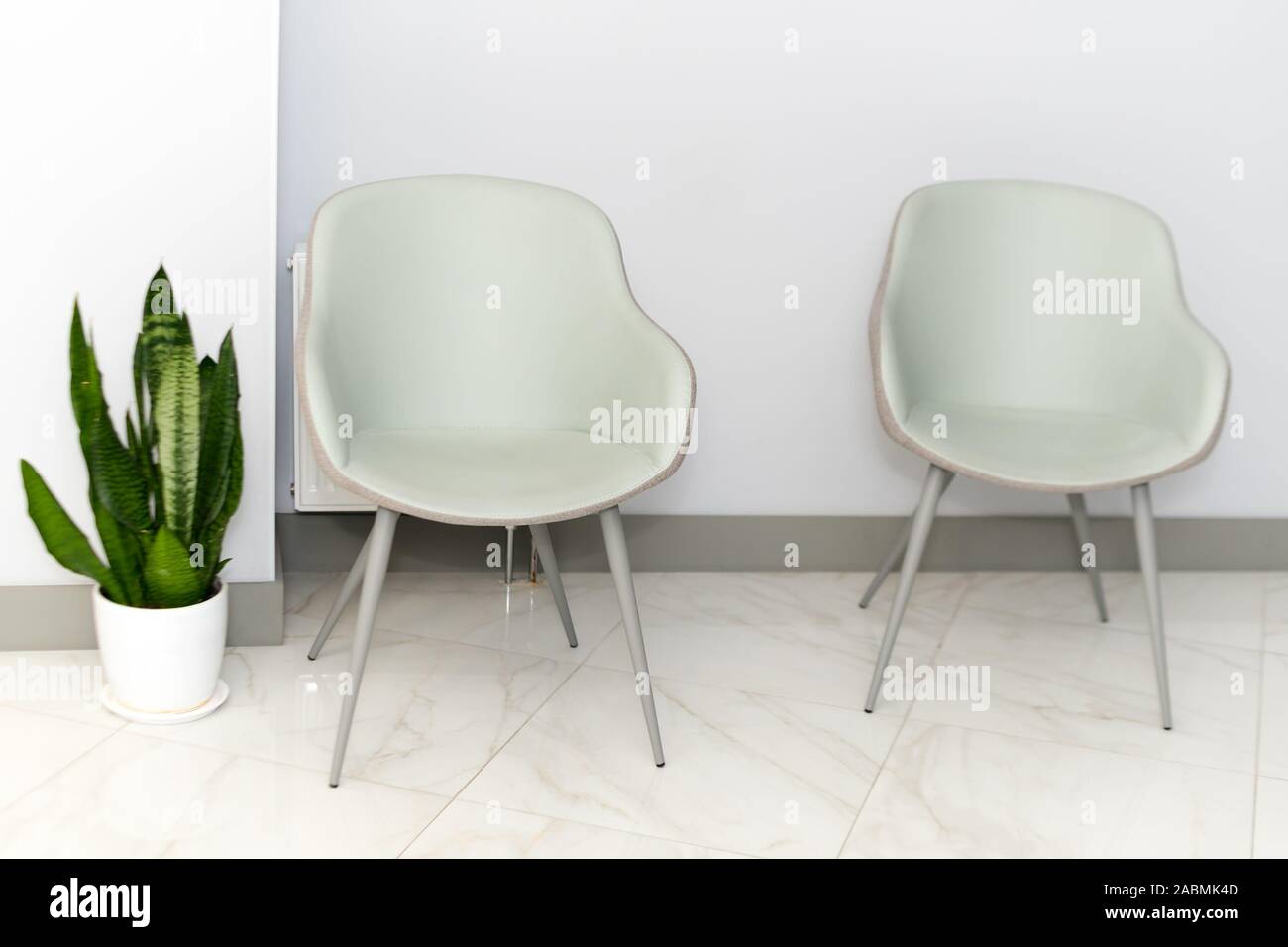 Corridor with chairs for patients in a modern hospital Stock Photo - Alamy