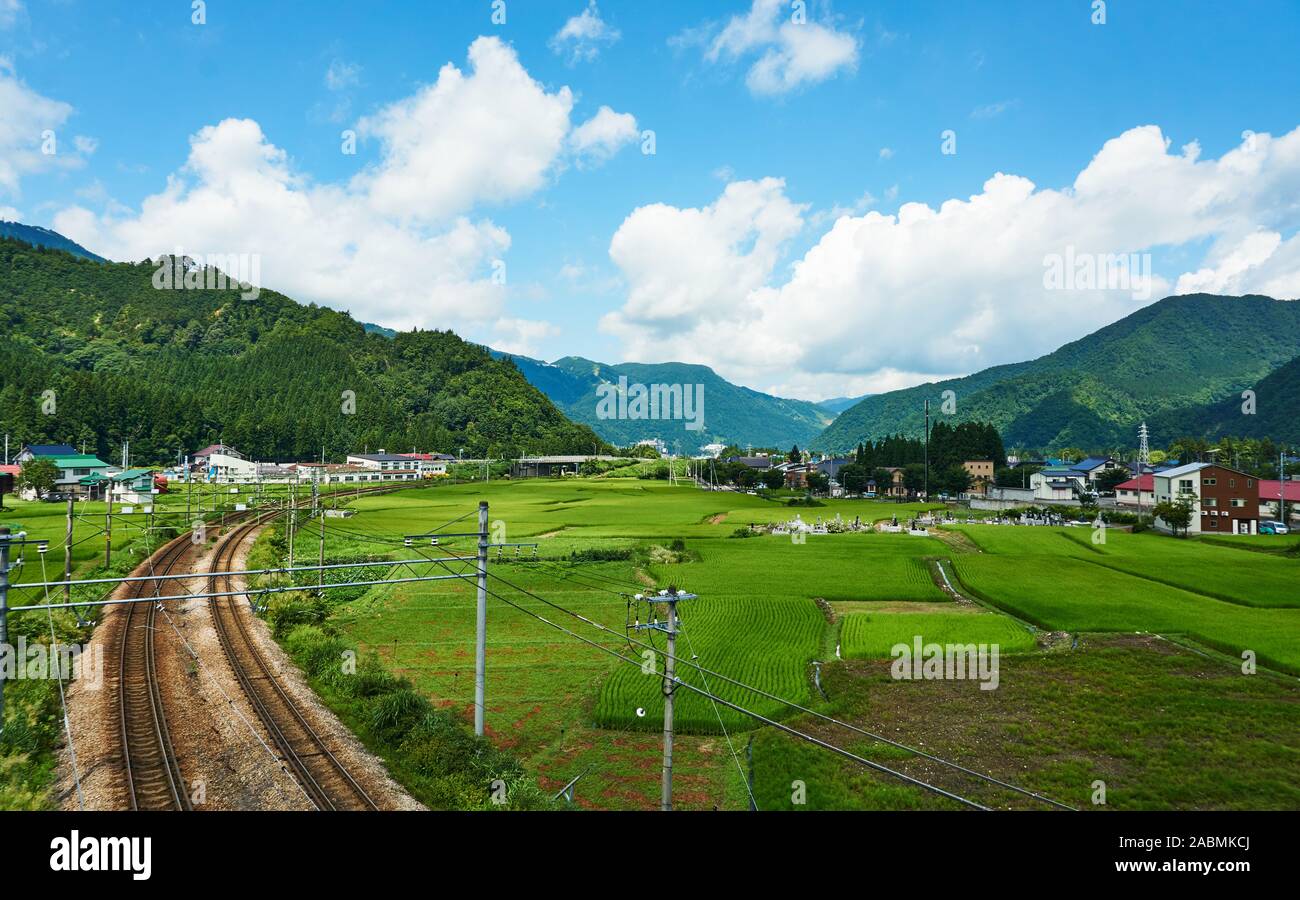Railway tracks on rice field hi-res stock photography and images - Alamy