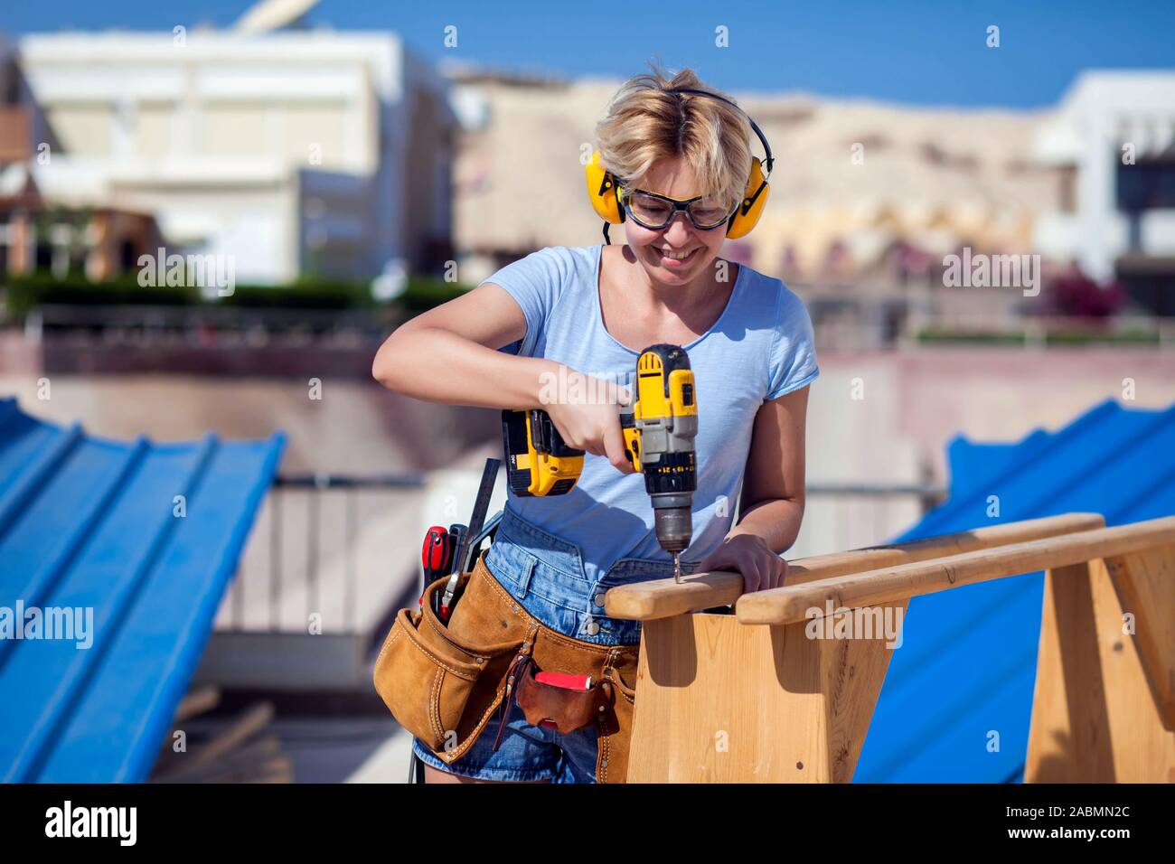 Woman tool belt hi-res stock photography and images - Alamy