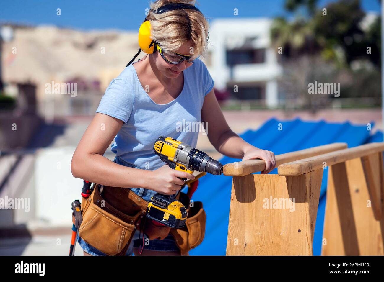 Female handyman drill hi-res stock photography and images - Alamy