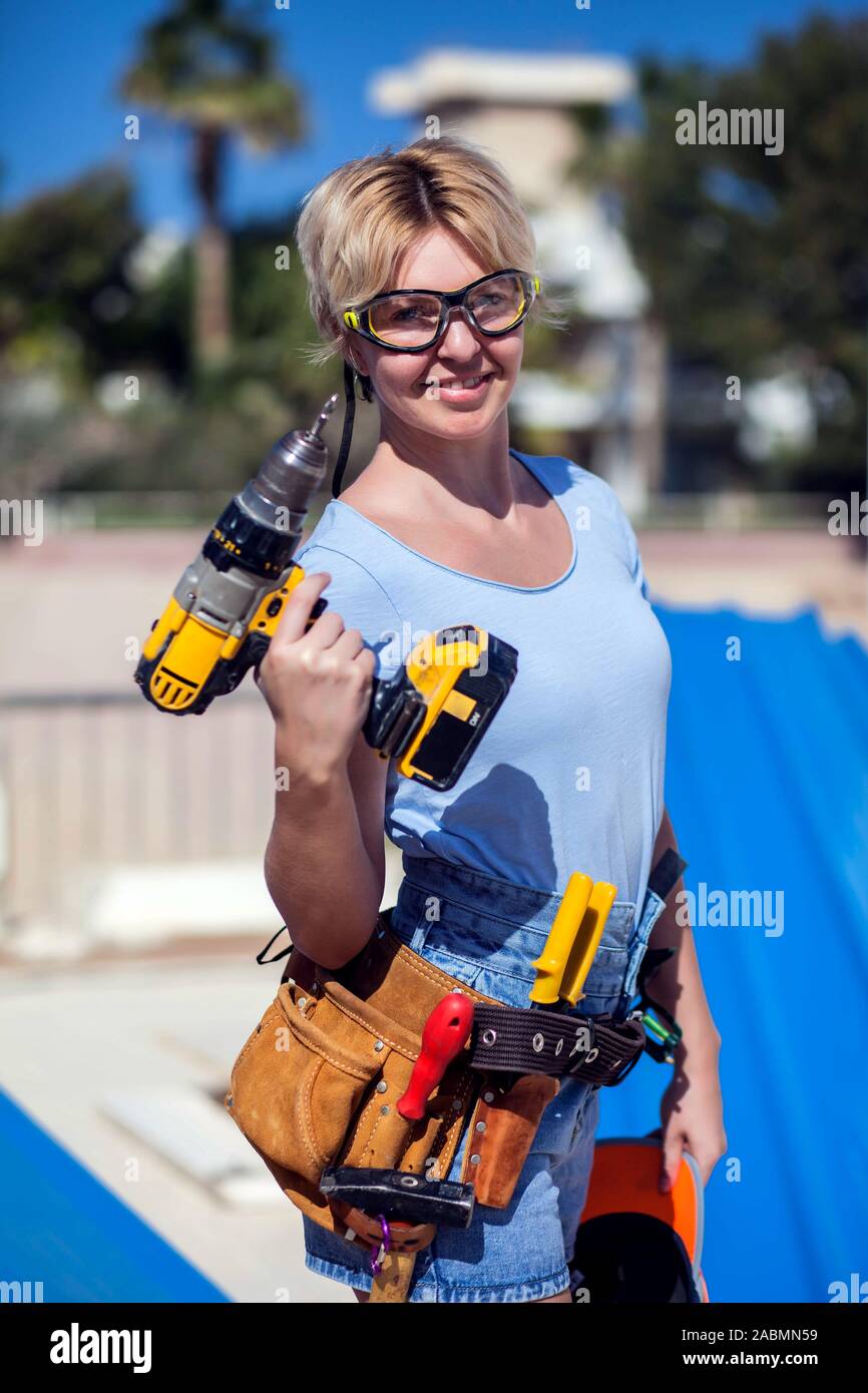Female handyman drill hi-res stock photography and images - Alamy