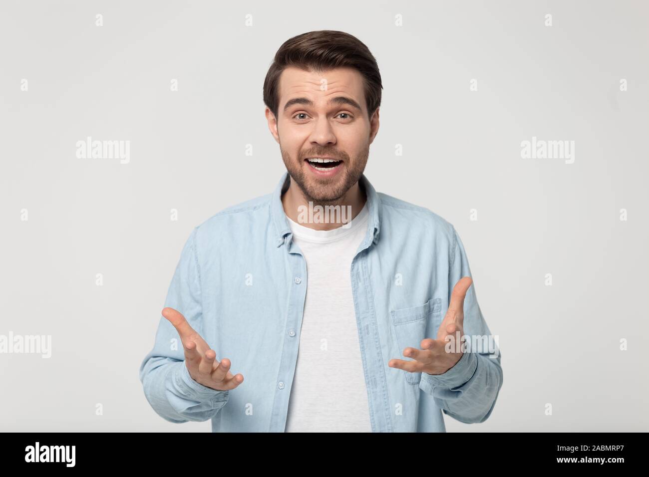 Surprised millennial man feel amazed isolated in studio Stock Photo - Alamy