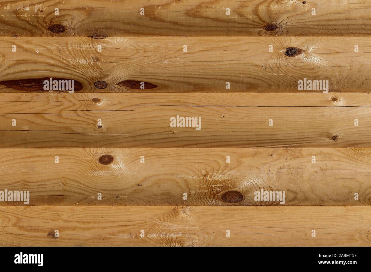 Wooden wall from logs of pine as a background texture Stock Photo - Alamy