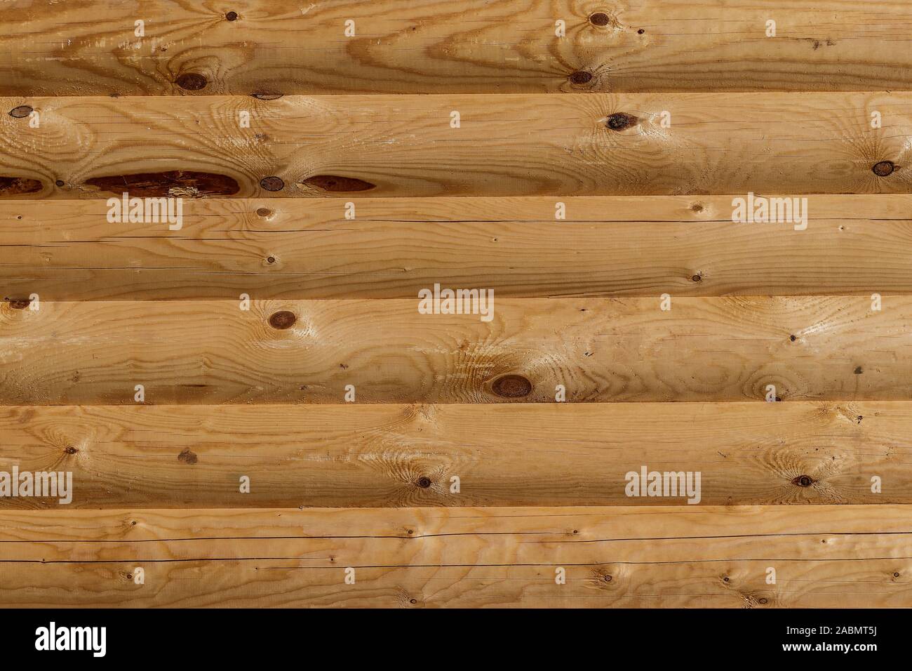 Wooden wall from logs of pine as a background texture Stock Photo - Alamy